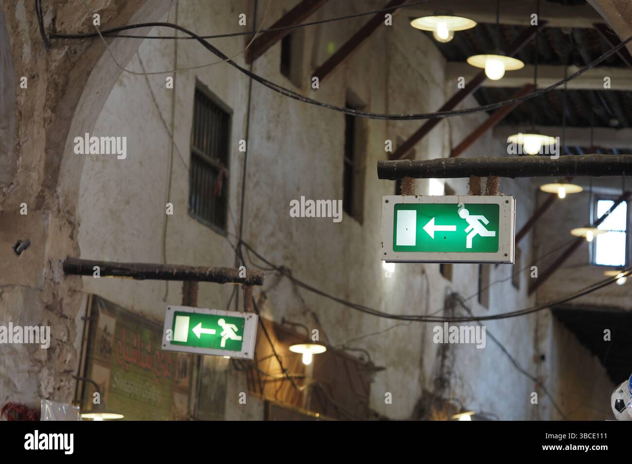Emergency exit signs in a historic building interior Stock Photo - Alamy