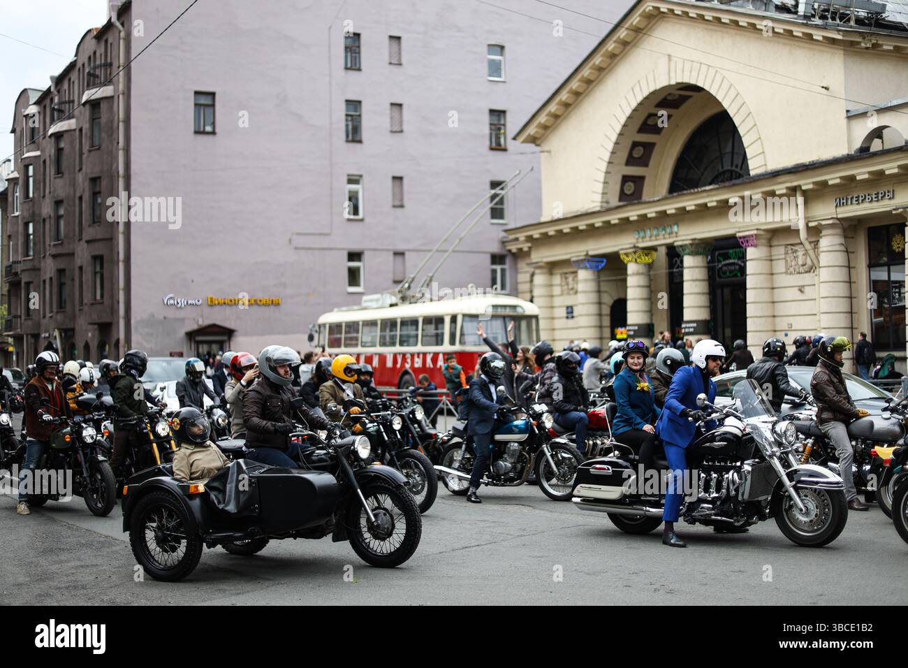 Participants ride their motorcycles during the start of the ...
