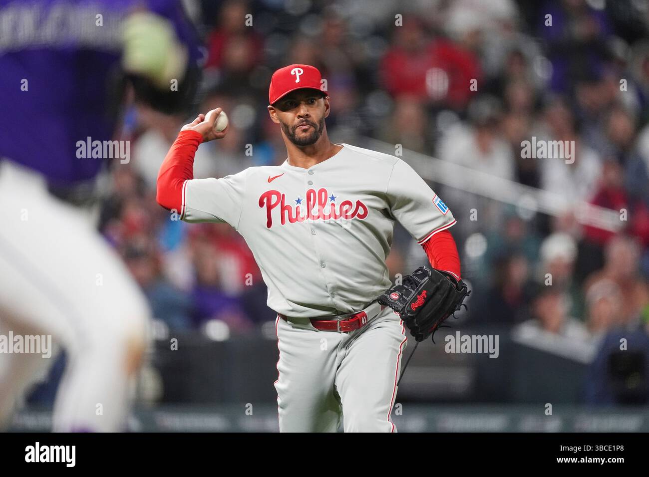 Philadelphia Phillies relief pitcher Joe Ross throws to first base to ...
