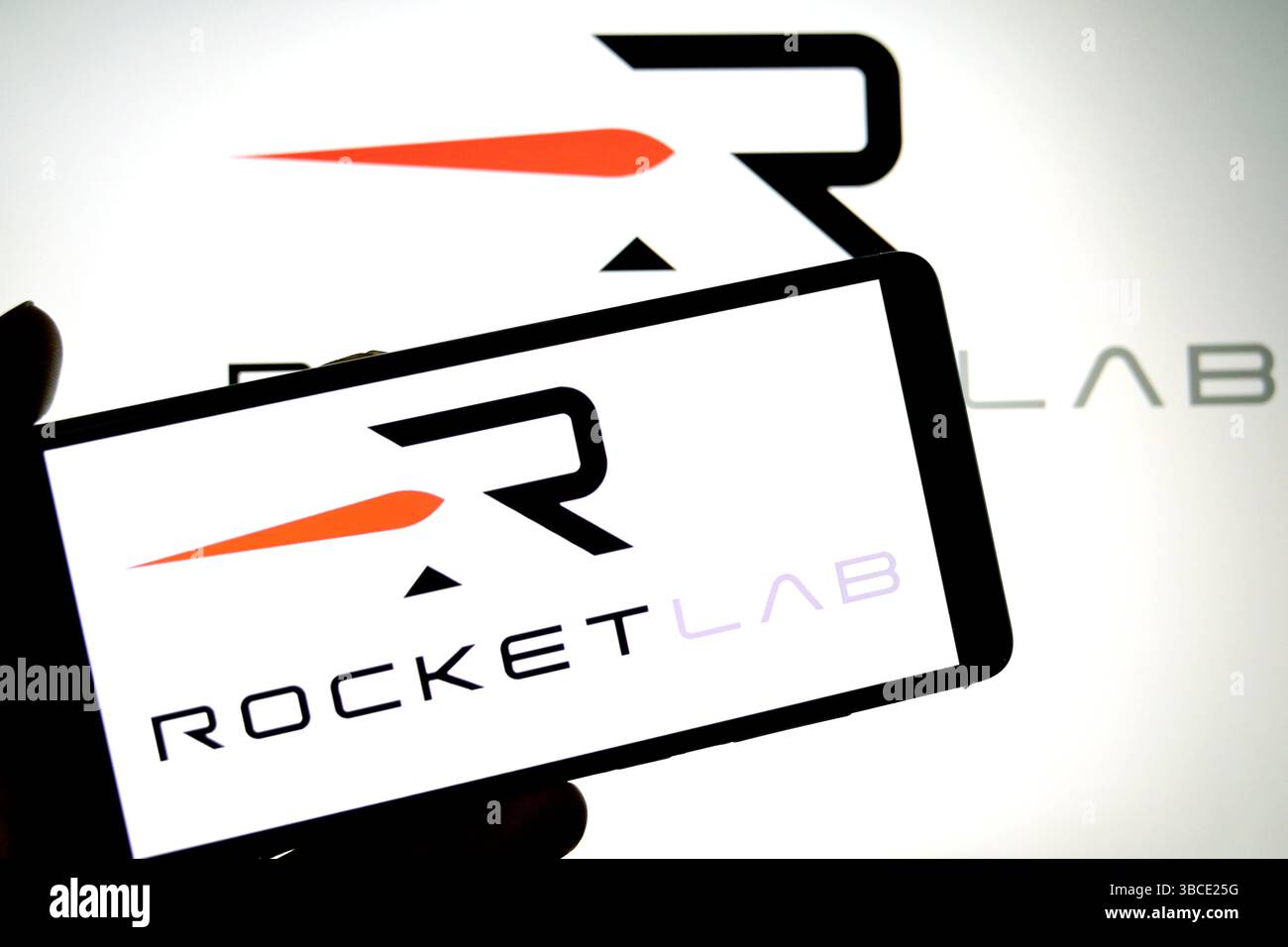 In this photo illustration, a Rocket Lab logo is seen displayed on a ...