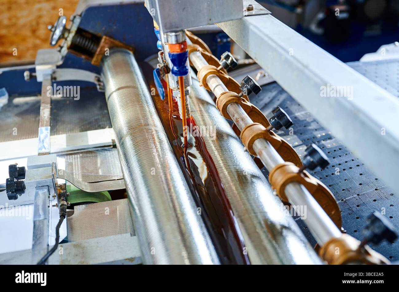 Precision glue application in an industrial machine used for top ...