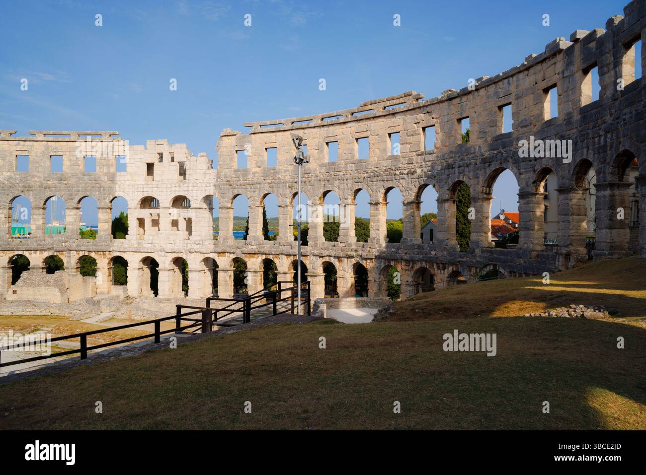 Ancient heritage in Pula, Istria, Croatia. Arches of monumental ancient ...