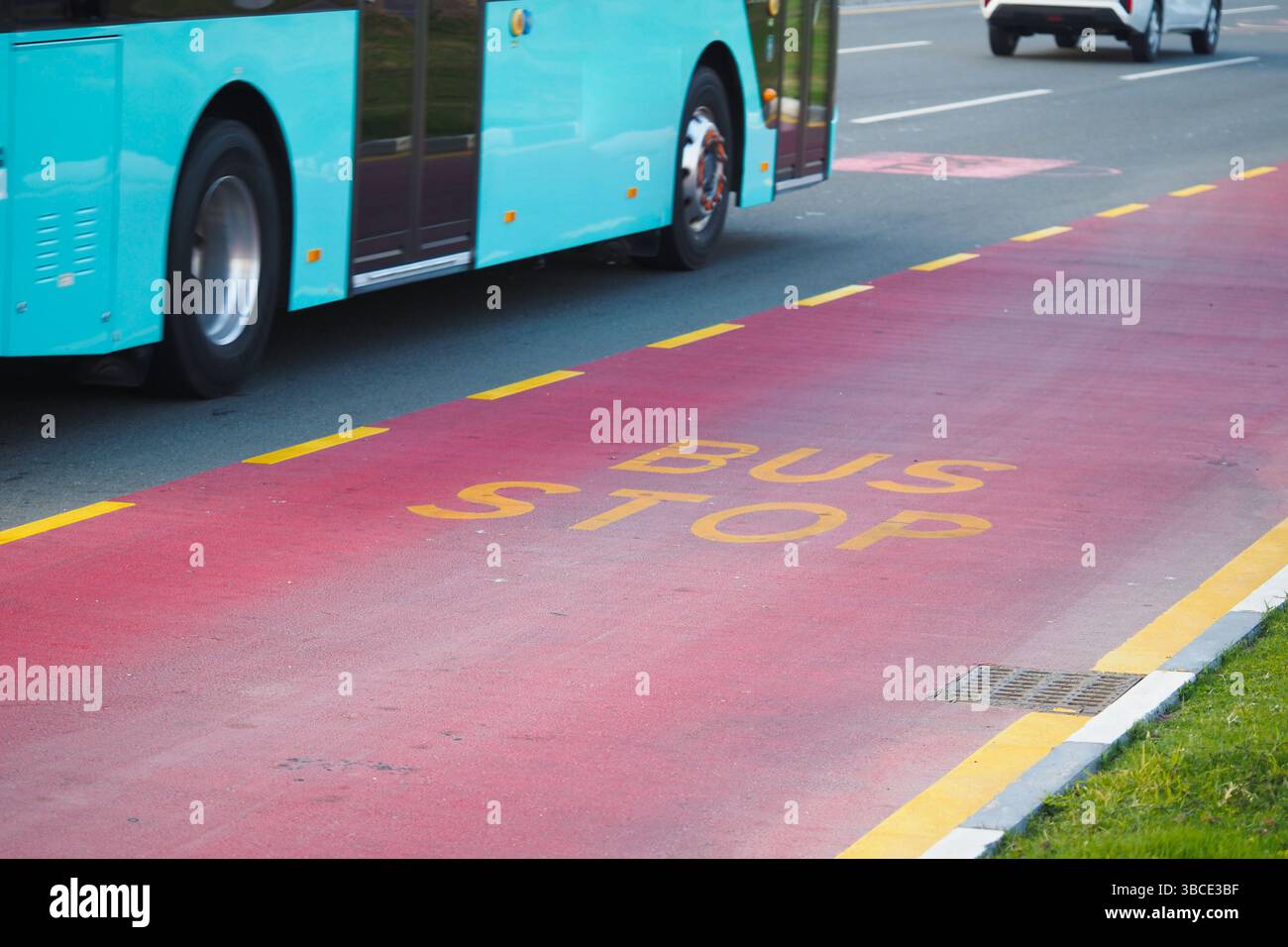 City bus stop and transit lane during daytime Stock Photo - Alamy