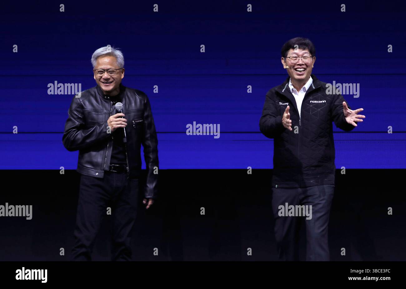 President and CEO of Nvidia Corporation Jensen Huang, left, smiles with ...