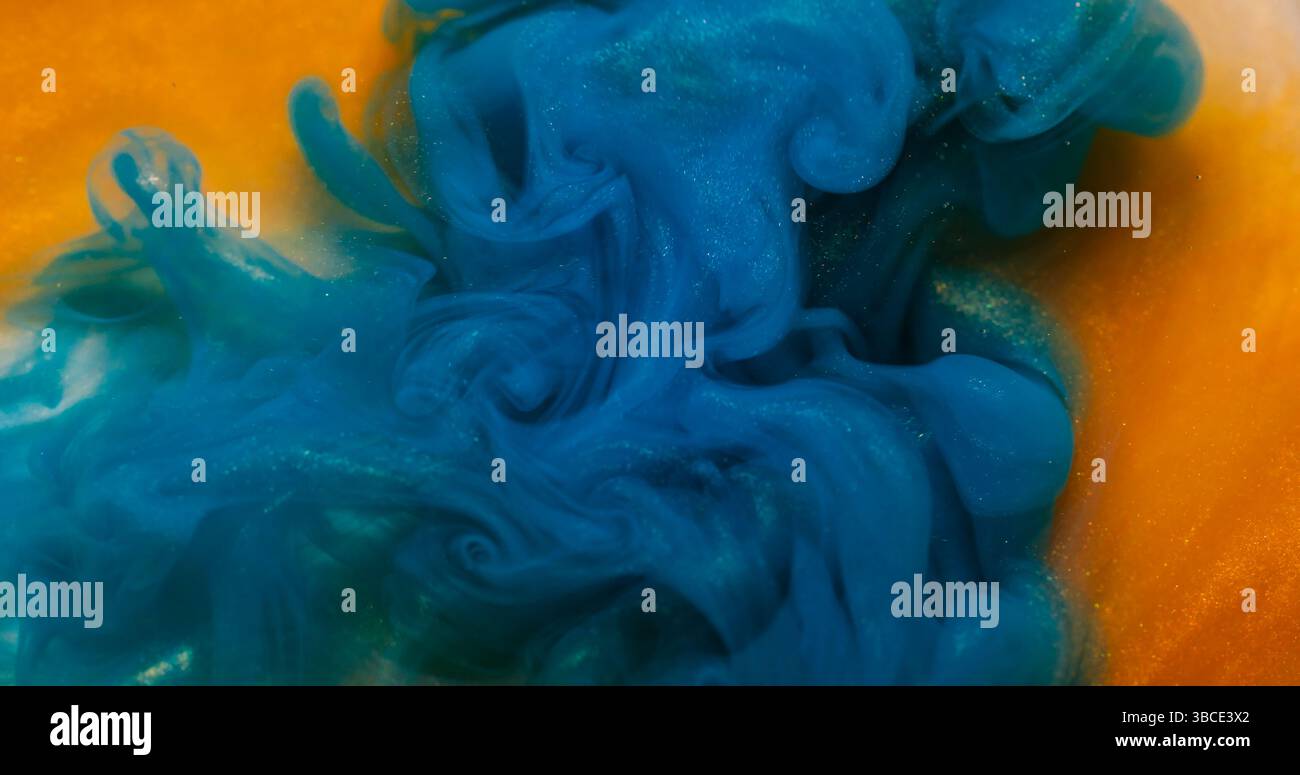 Color water. Paint flow. Defocused blue orange chemical liquid ...
