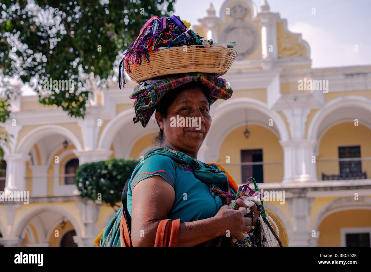 Indigenous Guatemalan woman selling crafts in Antigua with traditional ...