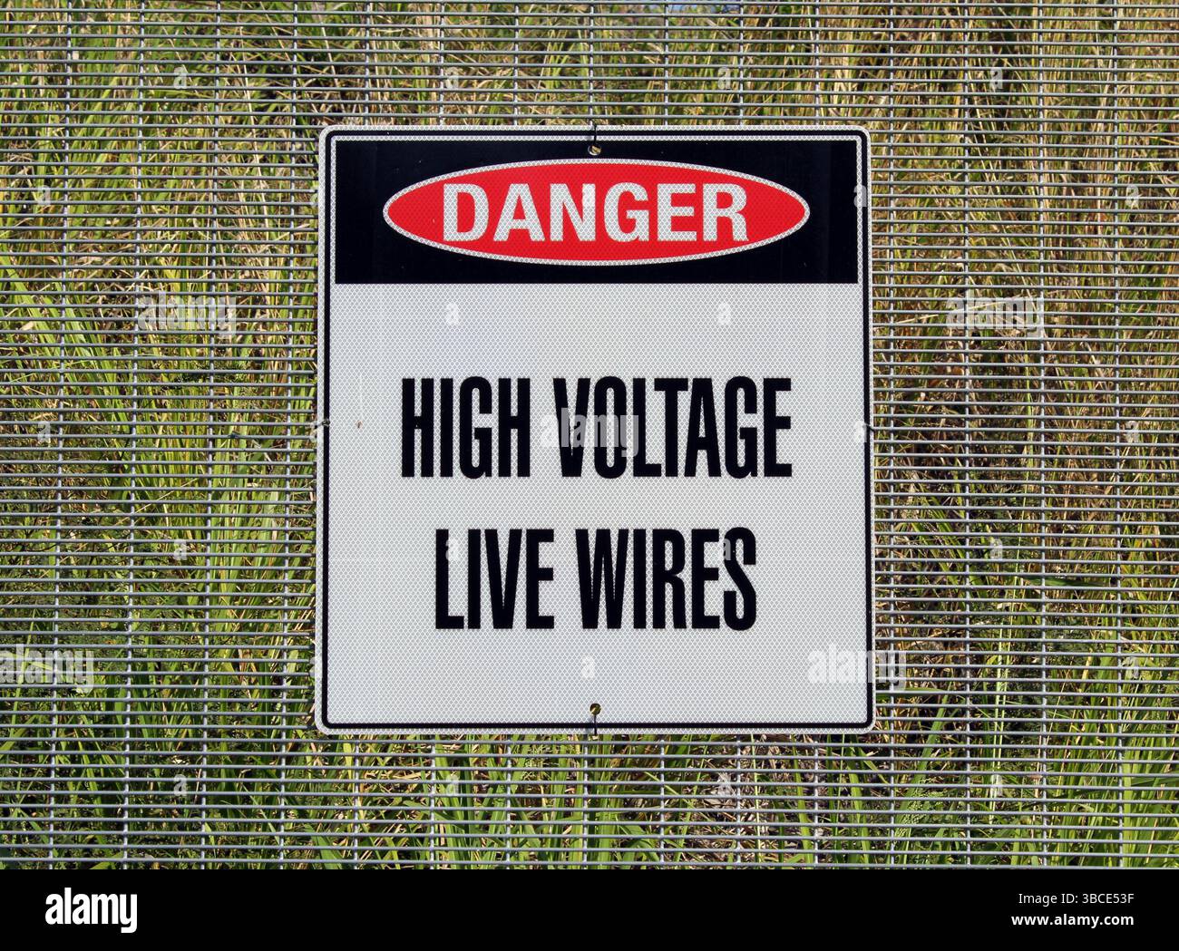Danger - High Voltage Live Wires sign attached to a fence Stock Photo ...