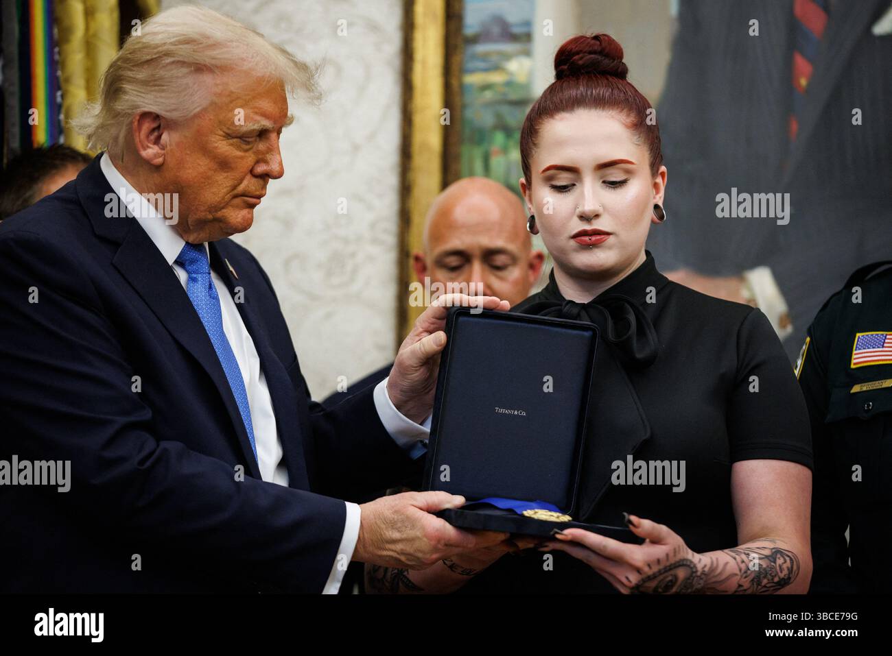 US President Donald Trump presents a Medal of Sacrifice to Alexandria ...