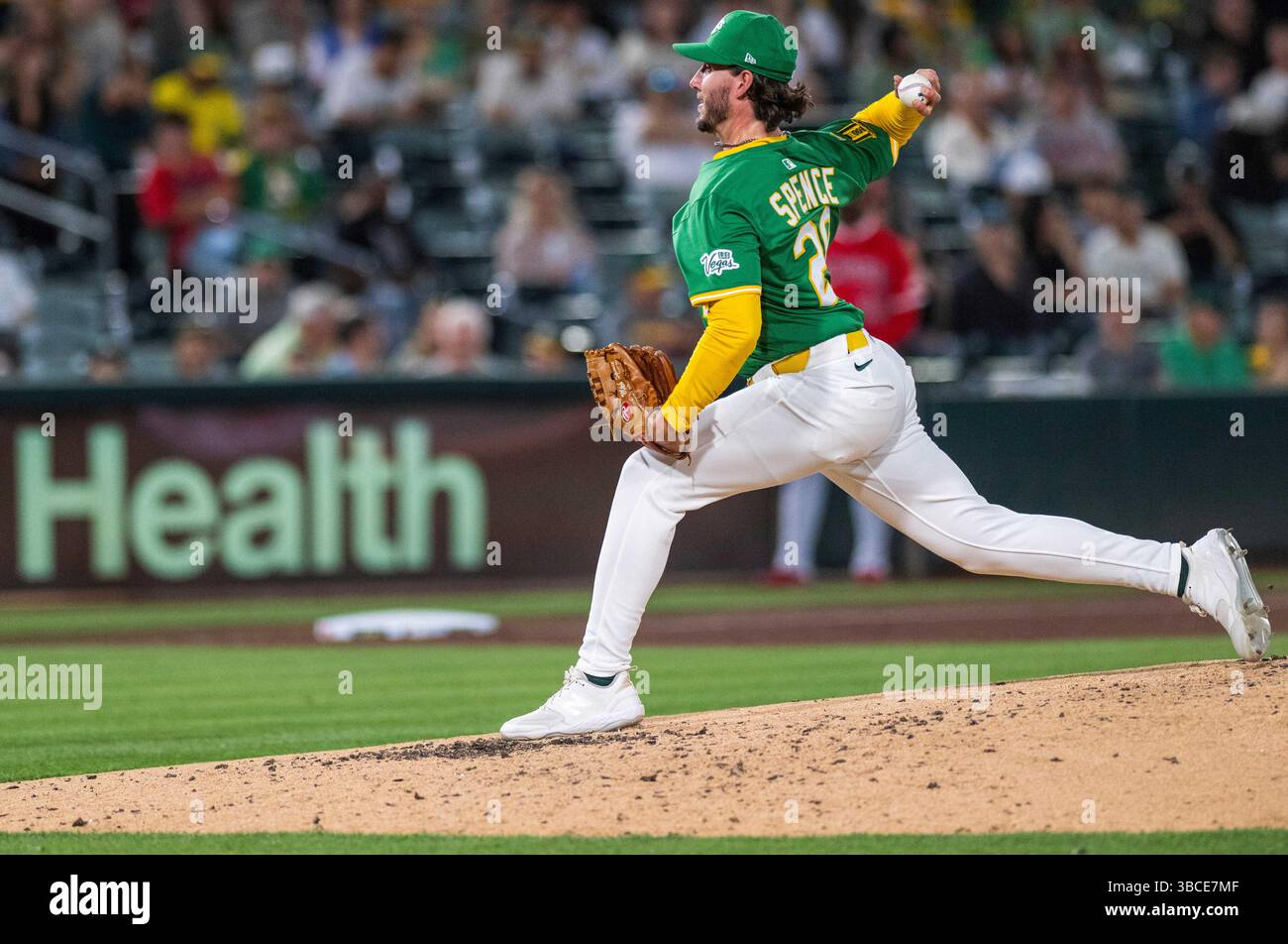 Athletics pitcher Mitch Spence throws during the sixth inning of a ...