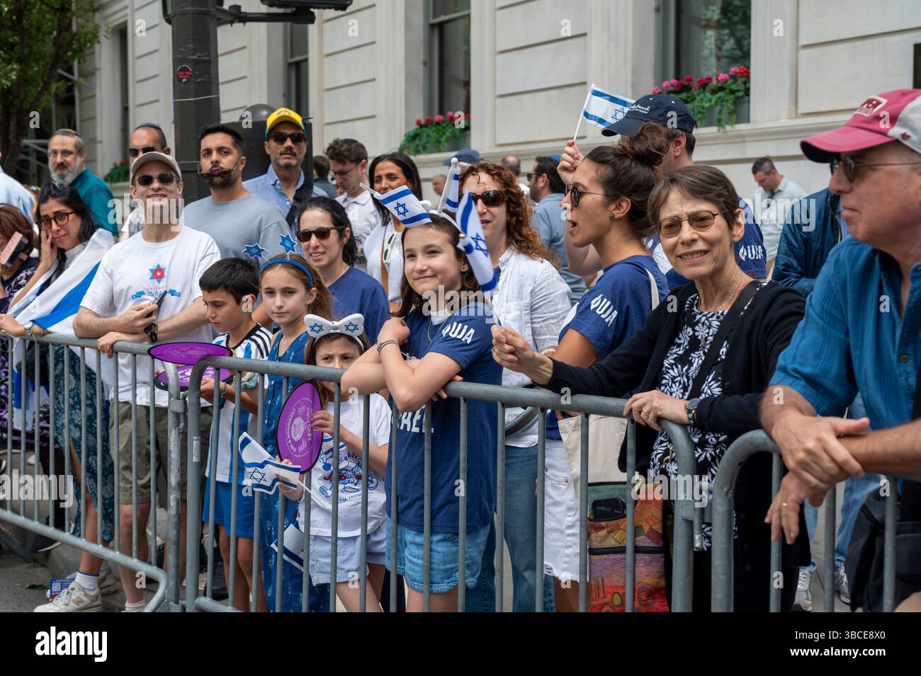 Thousands lined the sidewalks of Fifth Avenue to watch the Israel Day ...