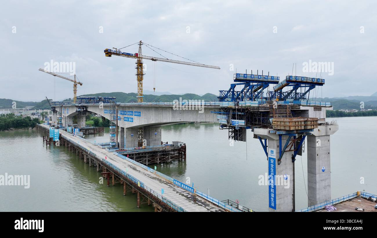 Workers are engaged in construction work at the construction site of ...