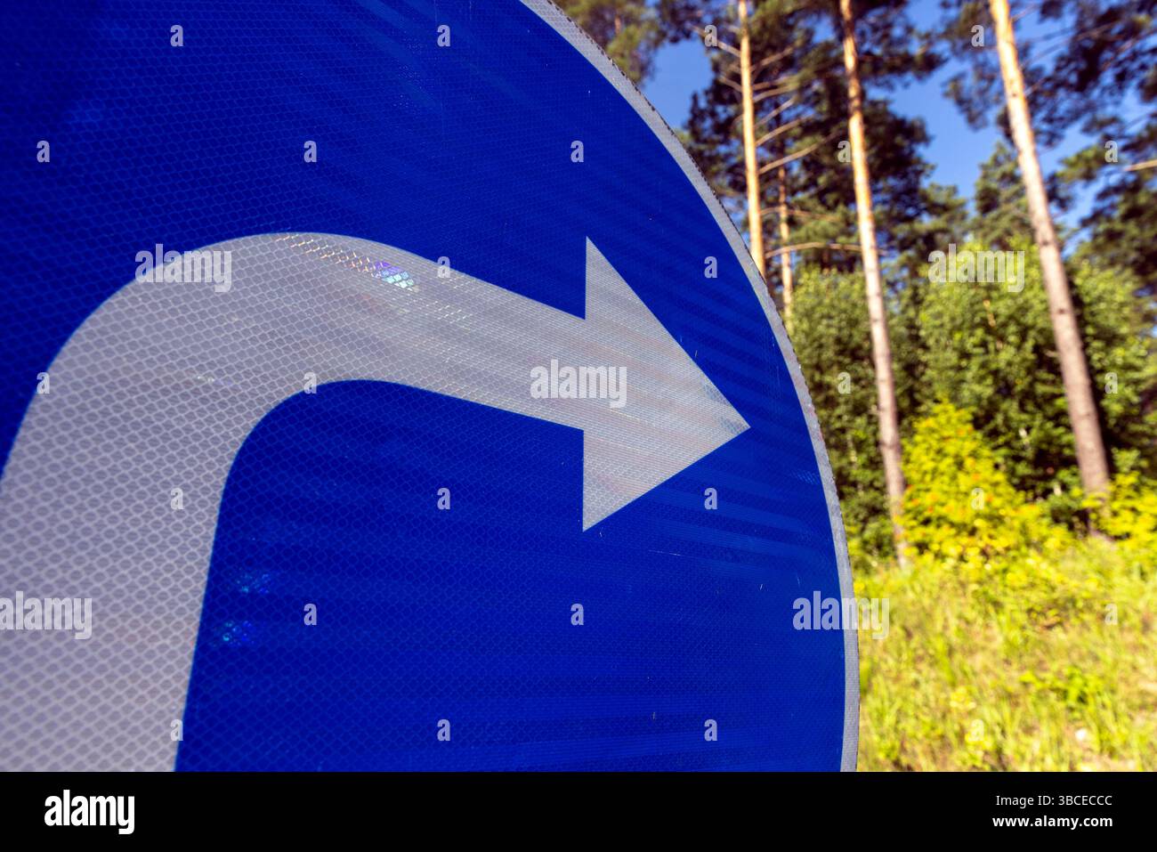 A road sign indicating the direction of movement for transport, a ...