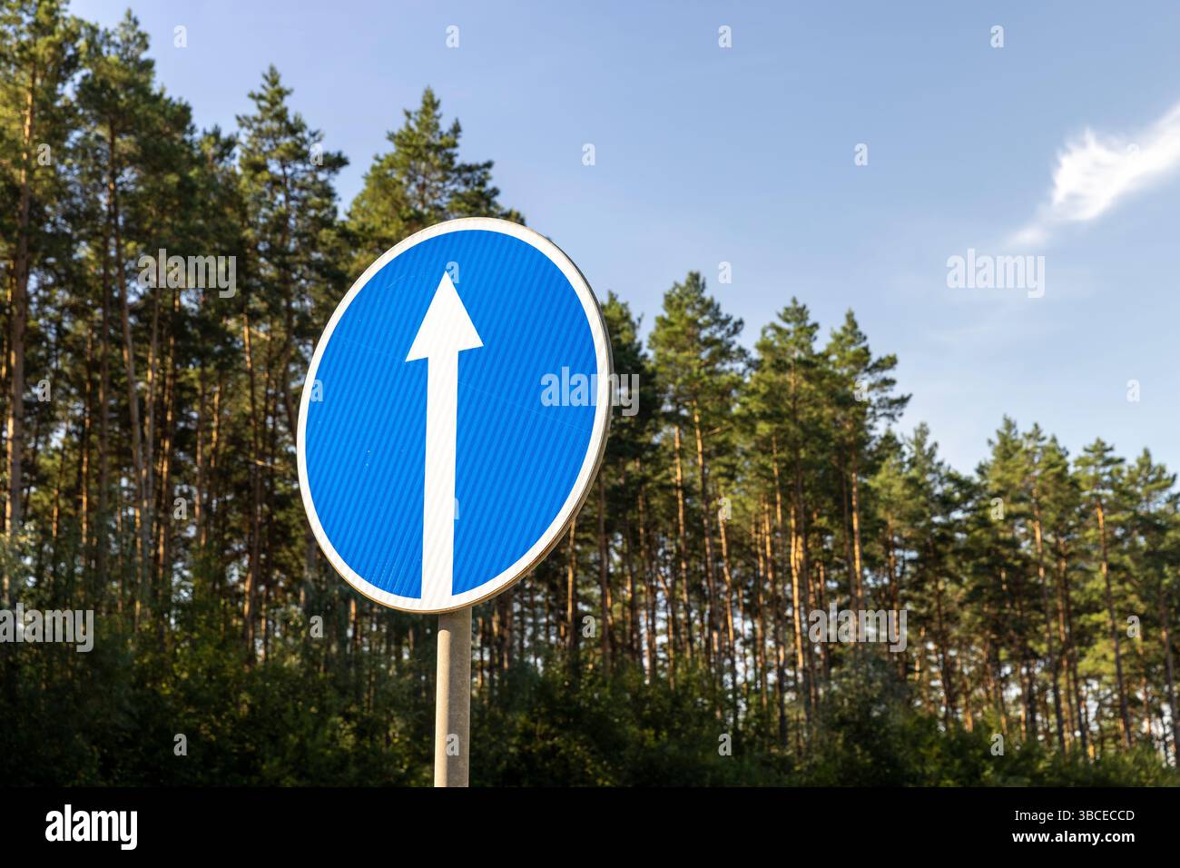 A road sign indicating the direction of movement for transport, a ...