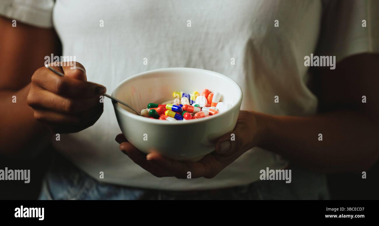 Hands, bowl and pills for addiction in studio with eating for mind ...