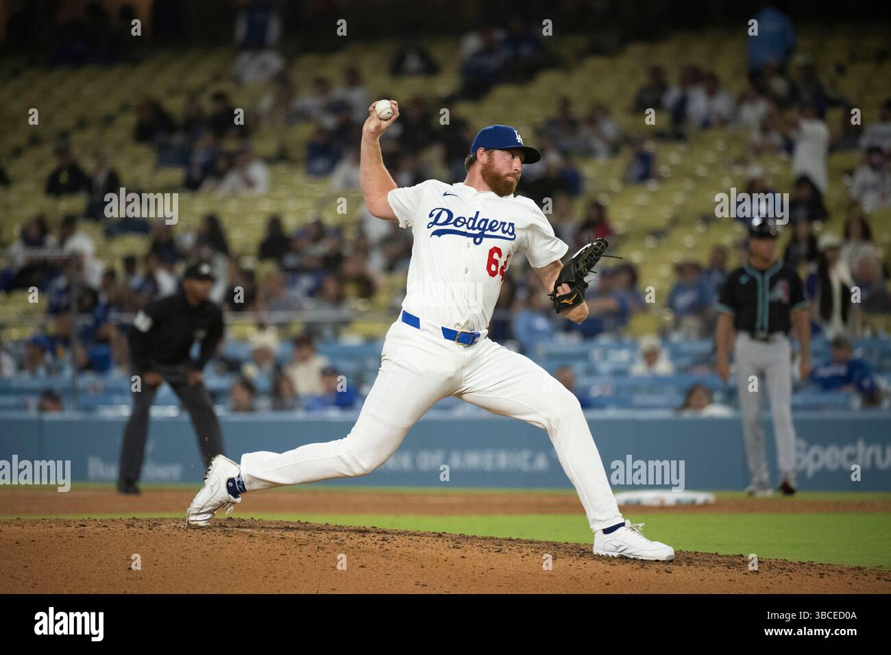 Los Angeles Dodgers relief pitcher Matt Sauer delivers a pitch during a ...