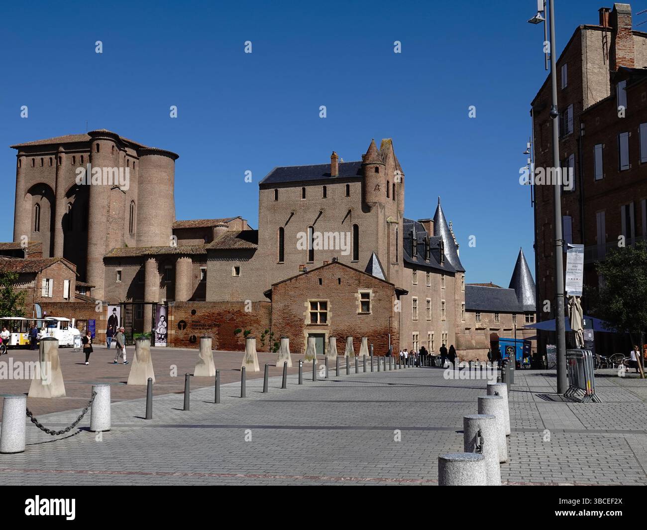 Red brick architecture of Albi, France with conical topped turrets and ...