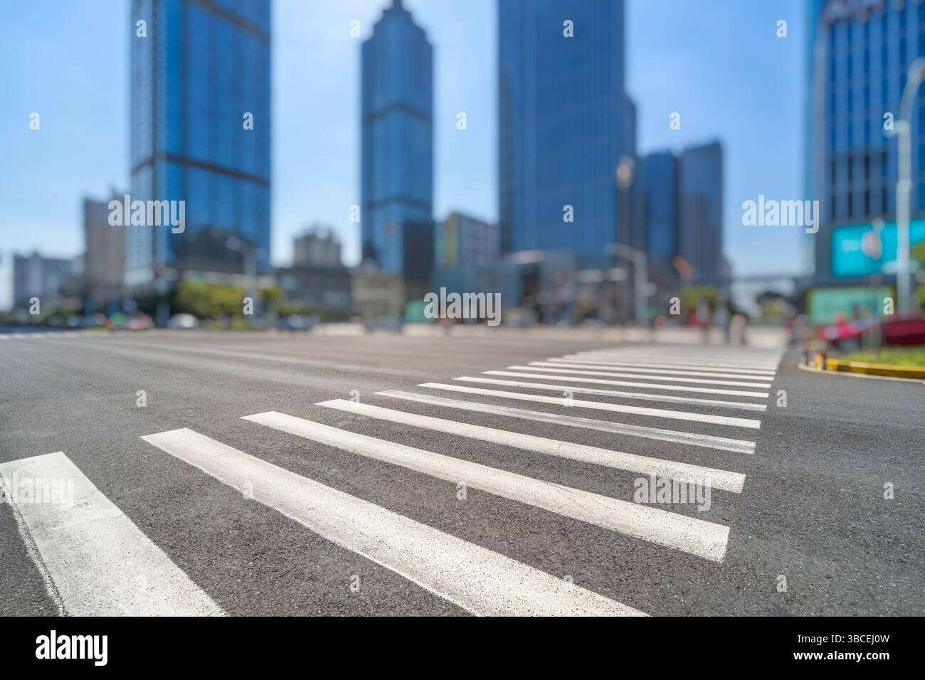empty road with zebra crossing and skyscrapers in modern city Stock ...