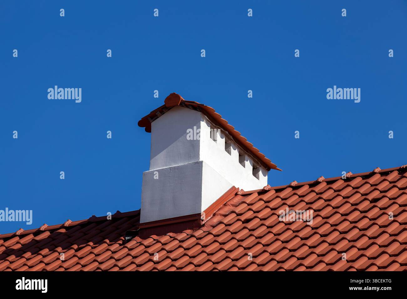 The roof made of classic red clay tiles, part of the roof of the house ...