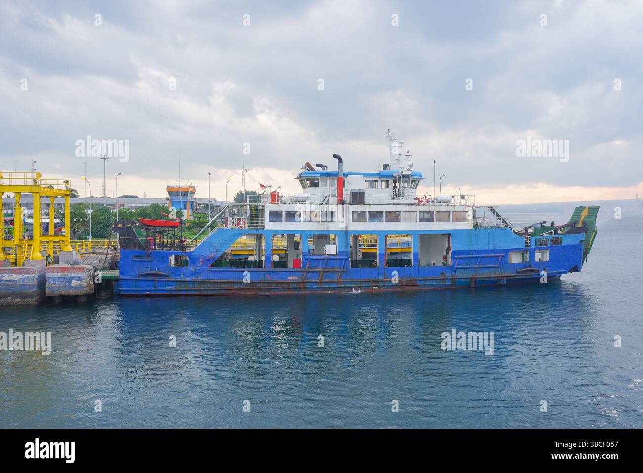 Ferry boat crossing the sea, carrying trucks cars and passengers, deck ...