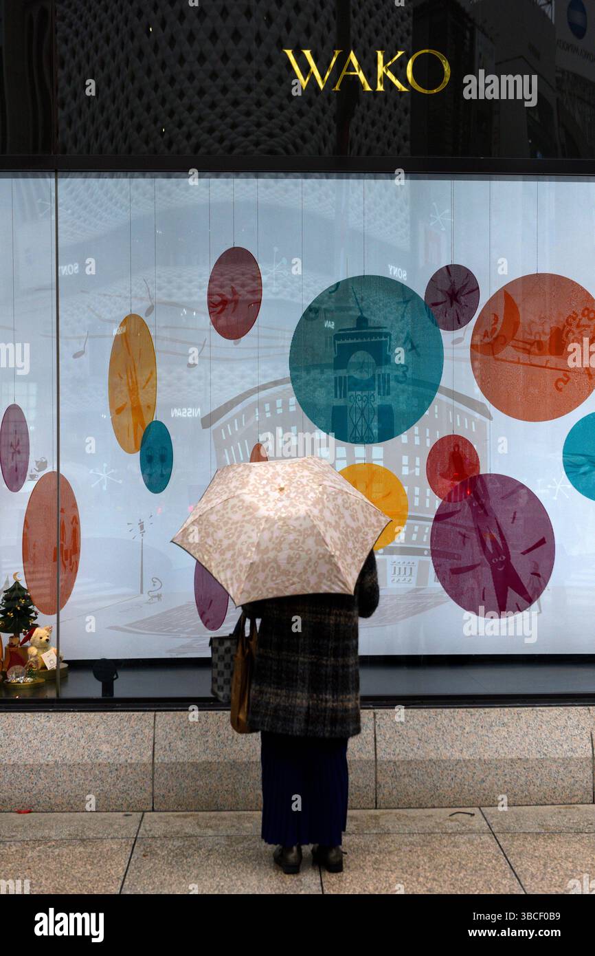 Window shopper with umbrella at Ginza,Tokyo,Honshu,Japan,Asia Stock ...