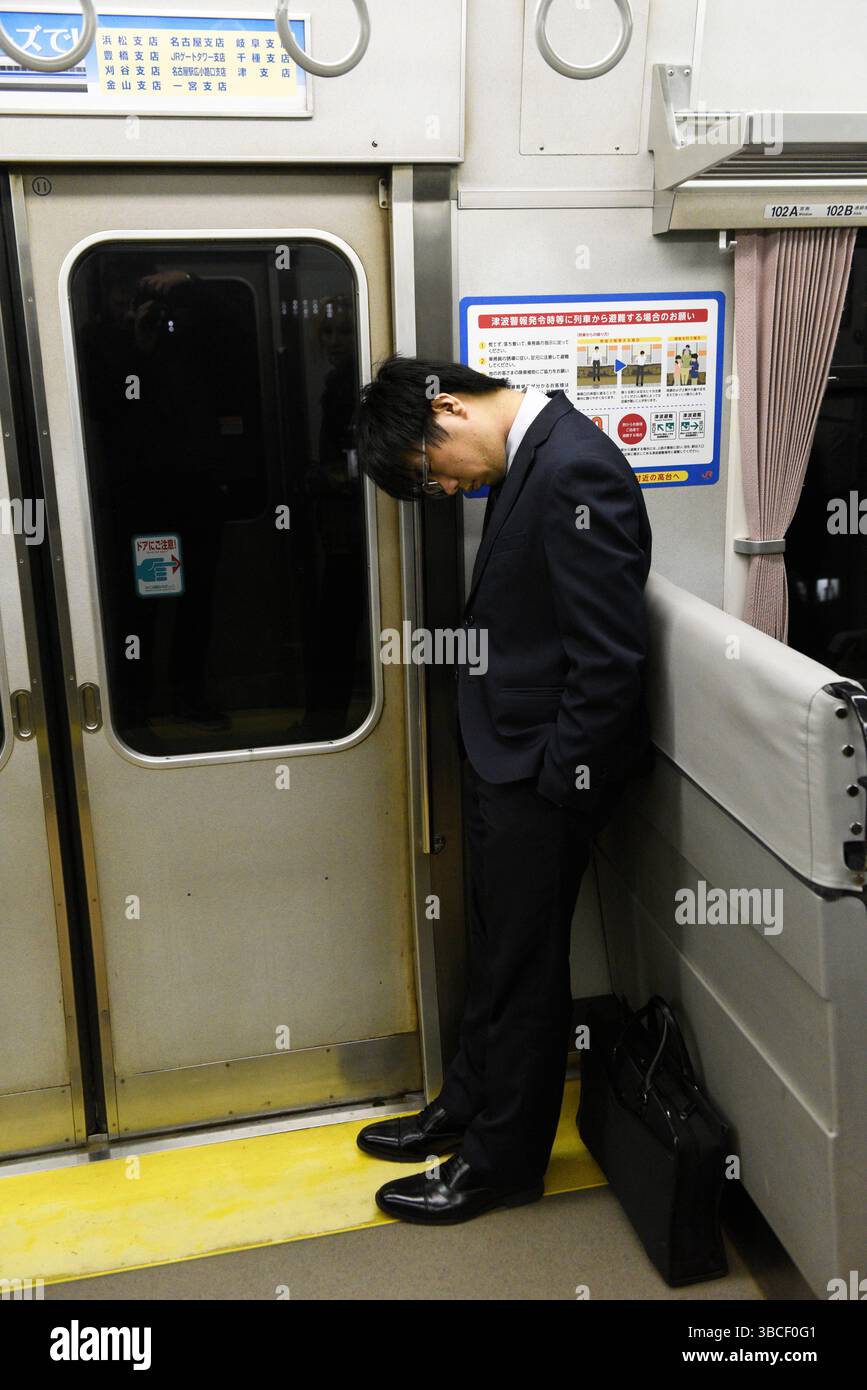 Japanese man nodding off sleeping failing asleep crowded standing on ...