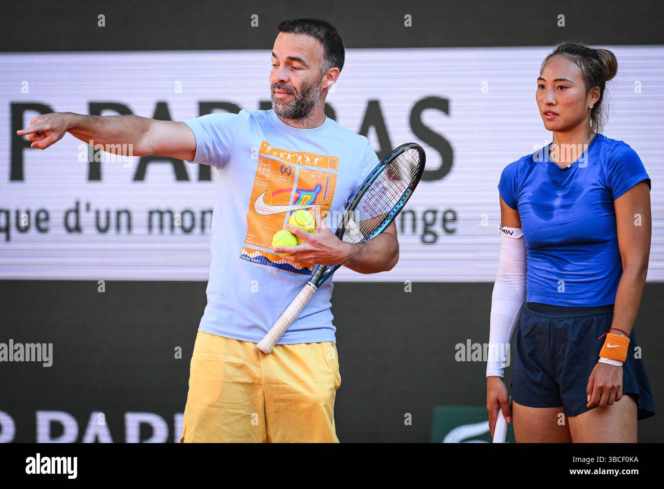 Paris, France. 20th May, 2025. Qinwen ZHENG of China with his coach Pere RIBA during a training ...