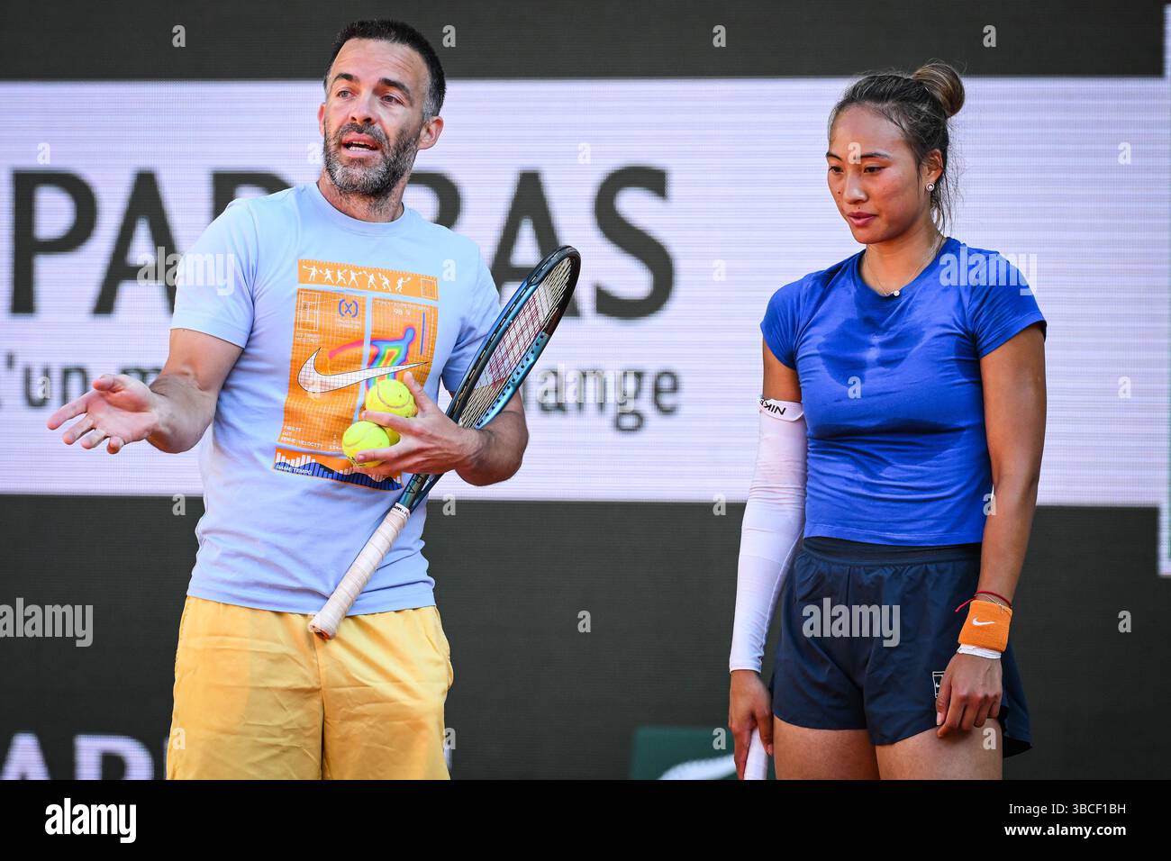 Qinwen ZHENG of China with his coach Pere RIBA during a training ...