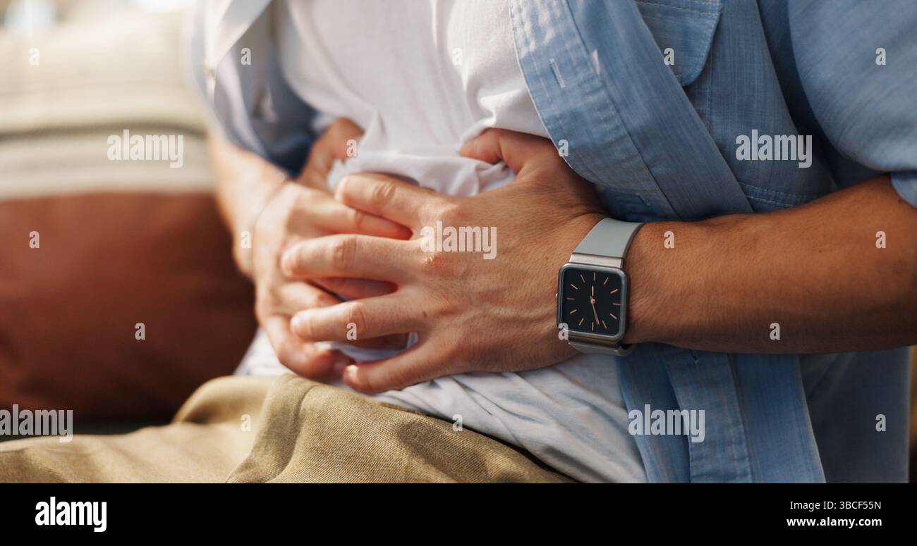 Person, hands and stomach ache with gastro infection, indigestion or ...