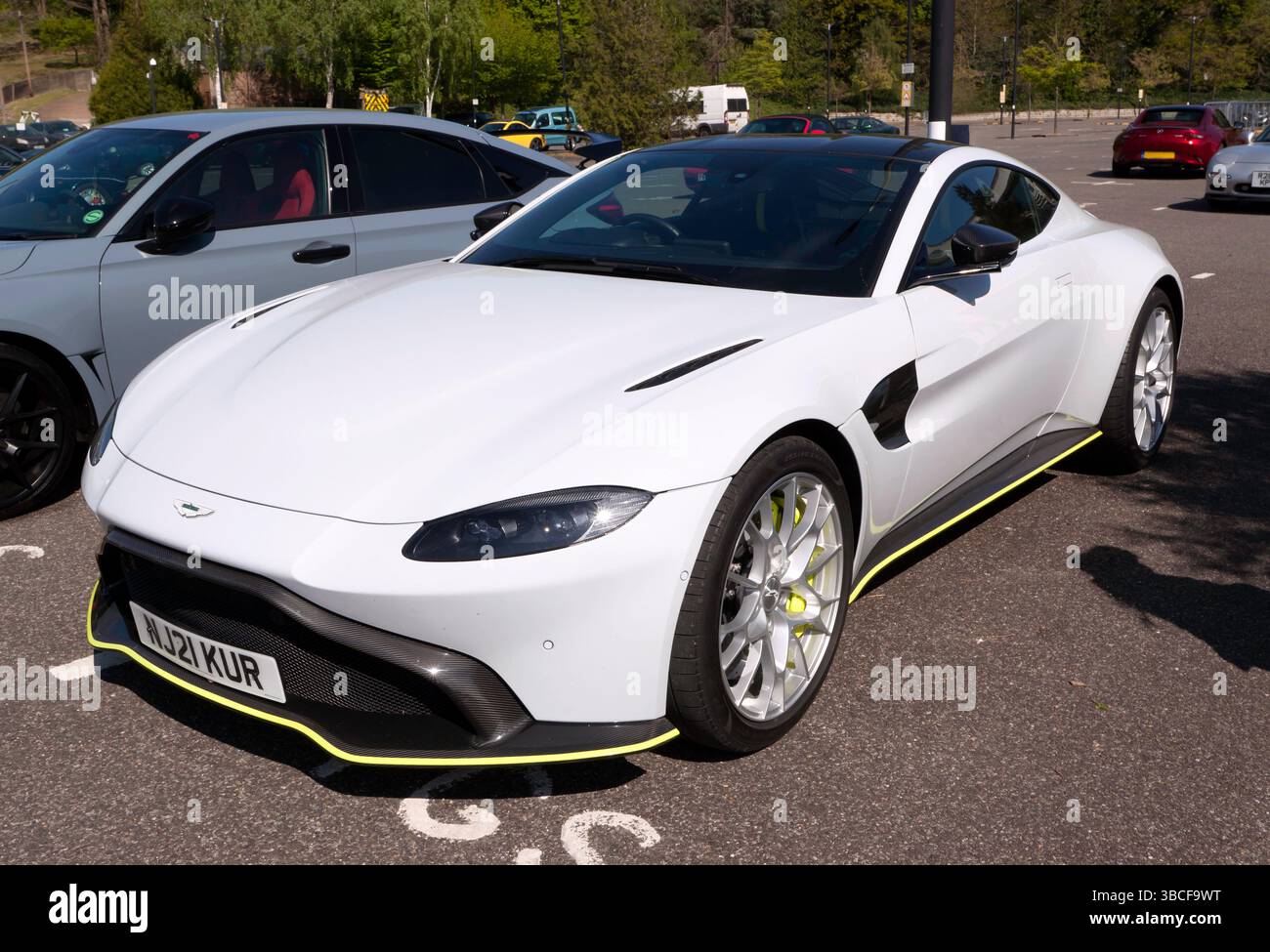 Three-quarter front view of a White, 2021, Aston martin Vantage AMR V8 ...