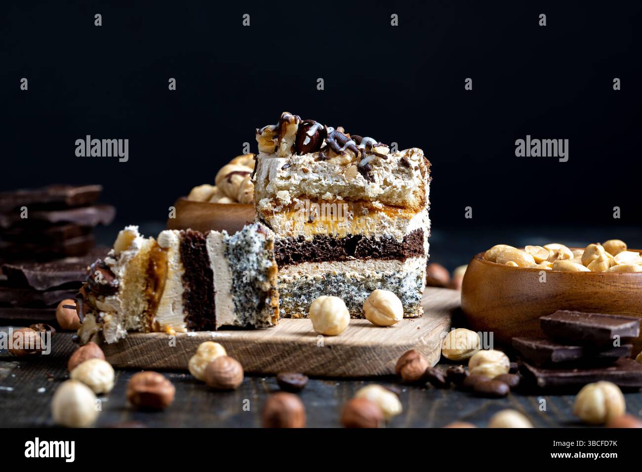 multi-layer cake with different layers, caramel, poppy seeds and cream ...