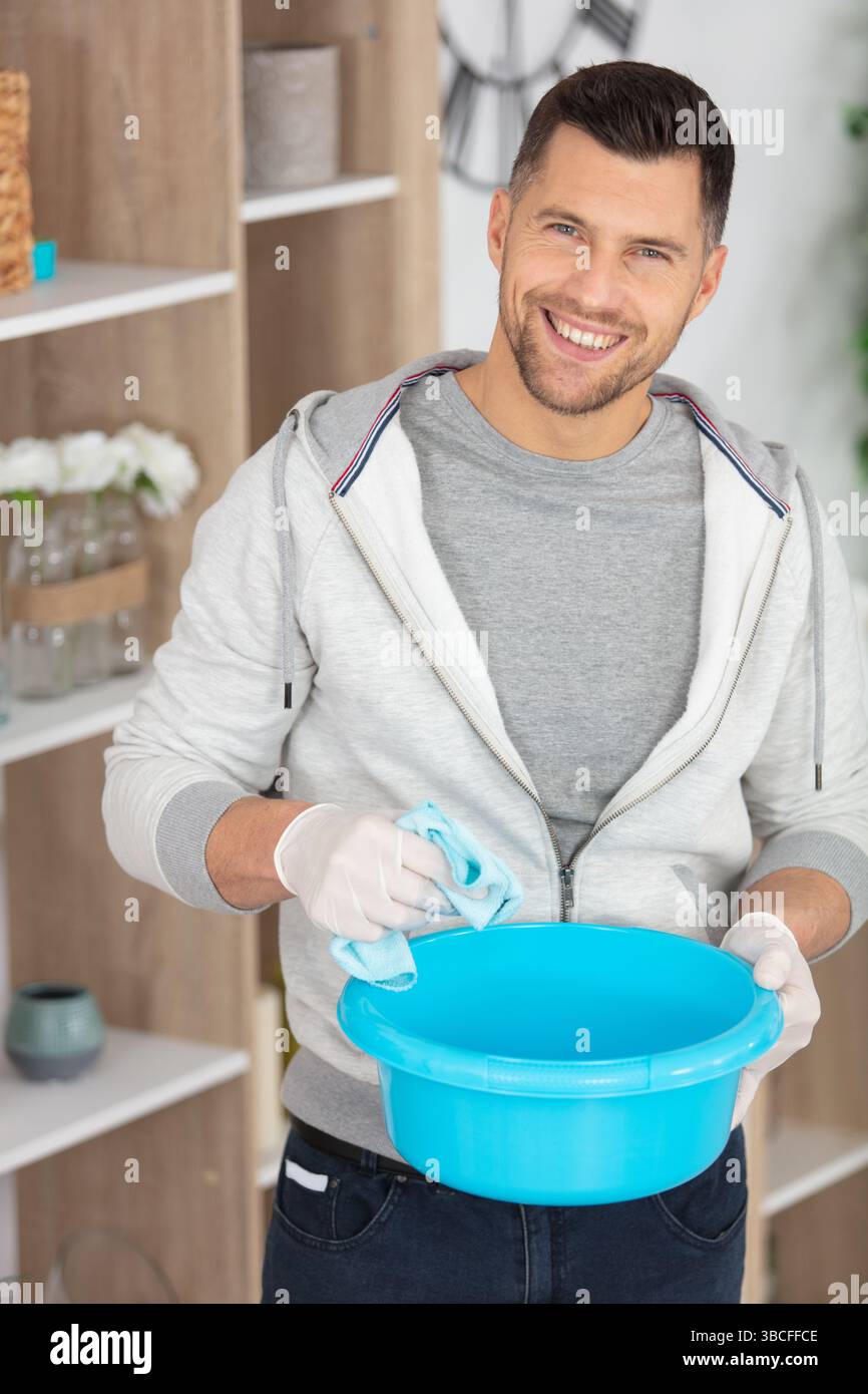 Bearded man cleaning home table hi-res stock photography and images - Alamy
