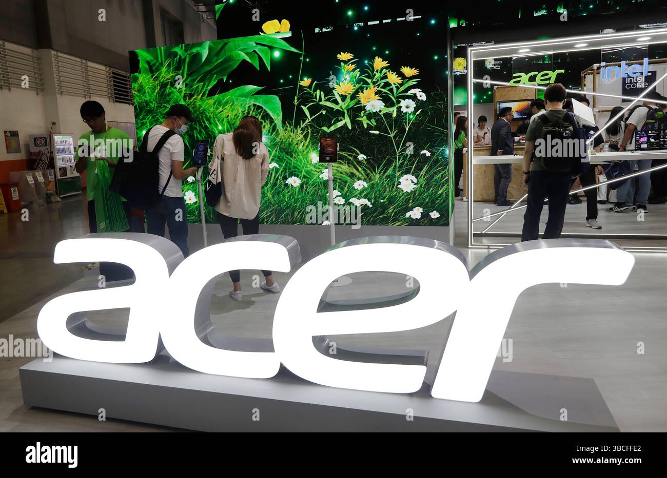Visitors walk through the Computex Taipei exhibition, one of the world's largest computer and ...
