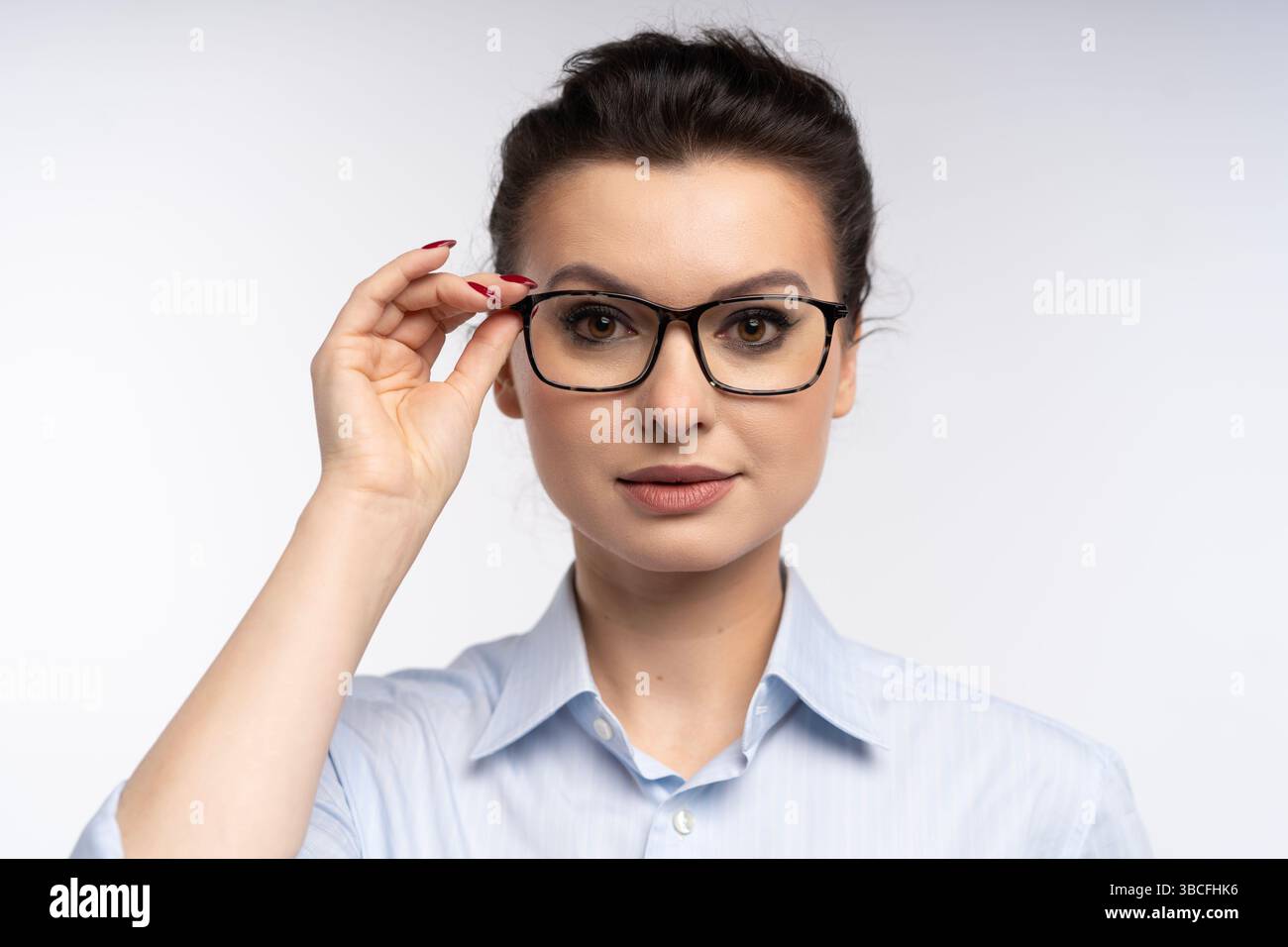 Photo of pretty businesswoman wearing eyeglasses standing in the office ...