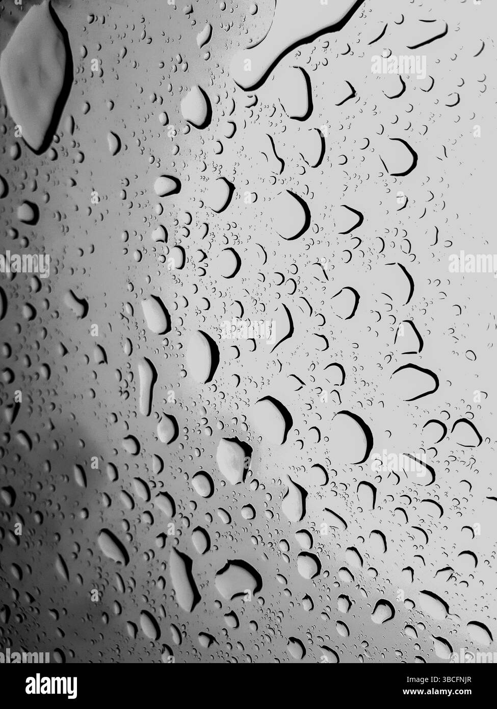 Water droplets collected on a glass window pane Stock Photo - Alamy