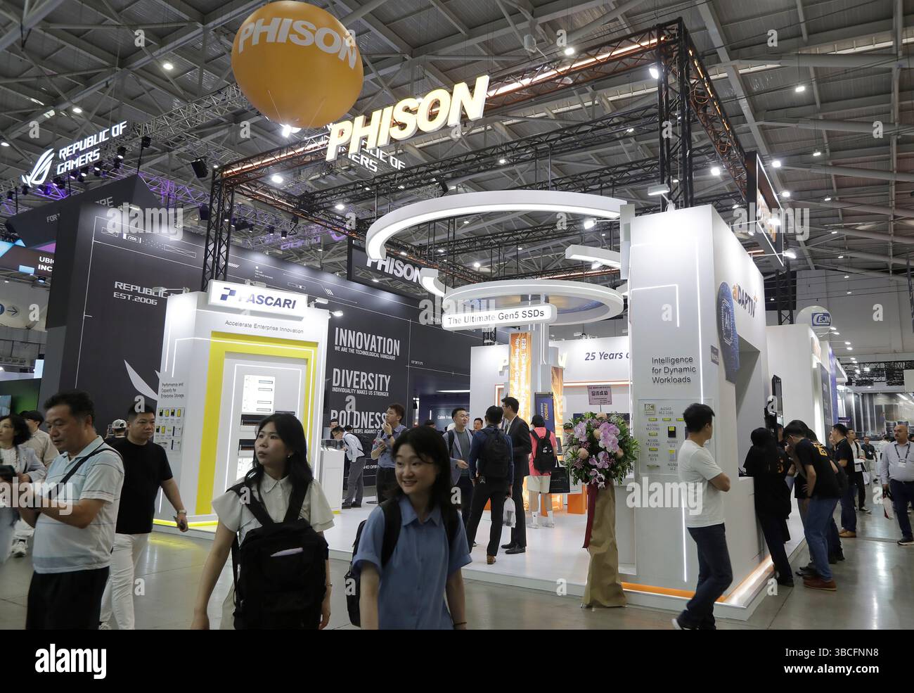 Visitors walk through the Computex Taipei exhibition, one of the world ...