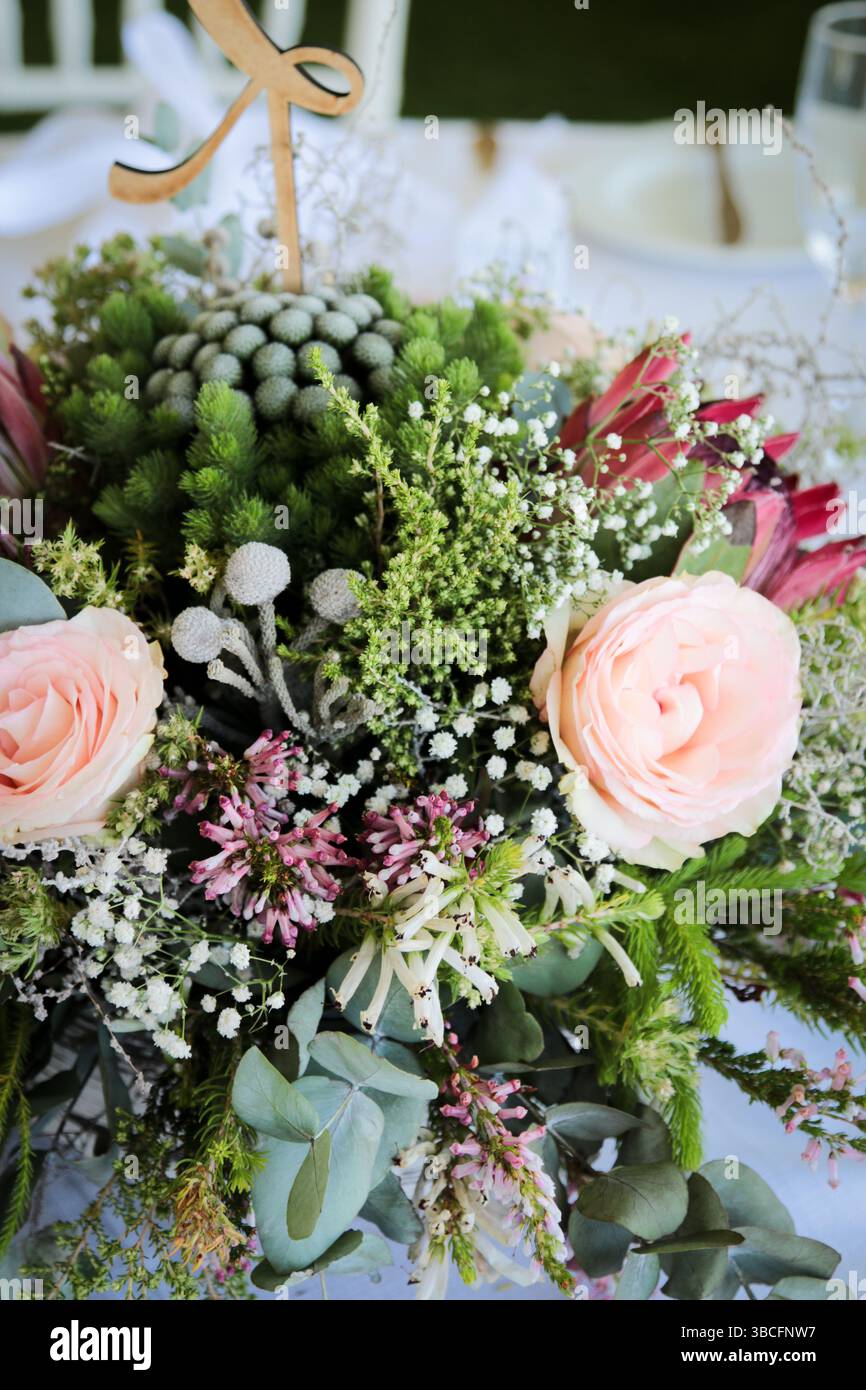 Rose, protea and fynbos table decor Stock Photo - Alamy