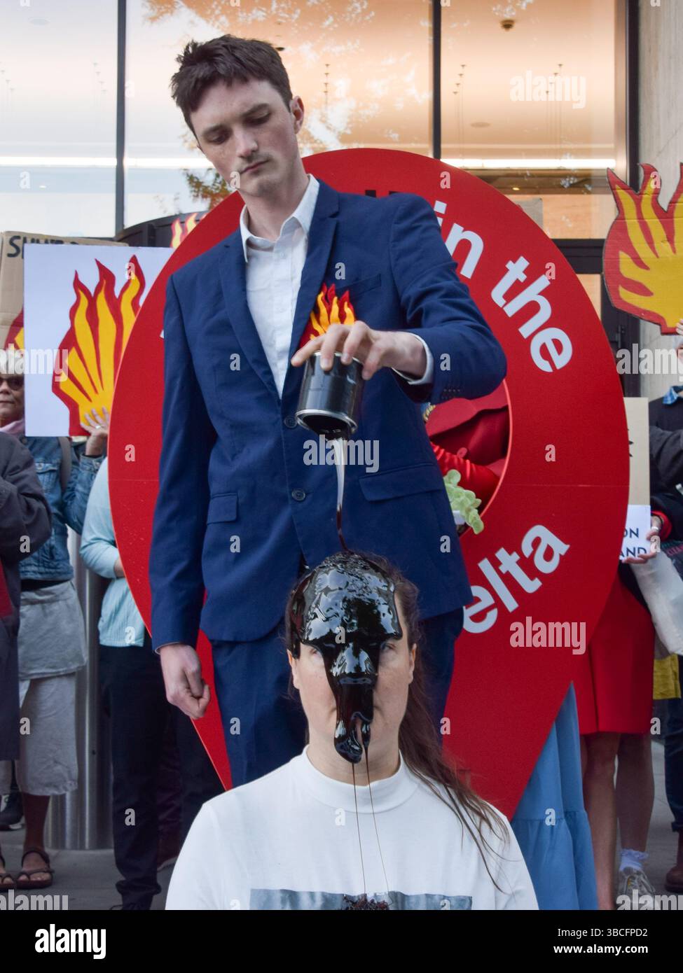 London, UK. 20th May 2025. Environmental activists pour fake oil over ...