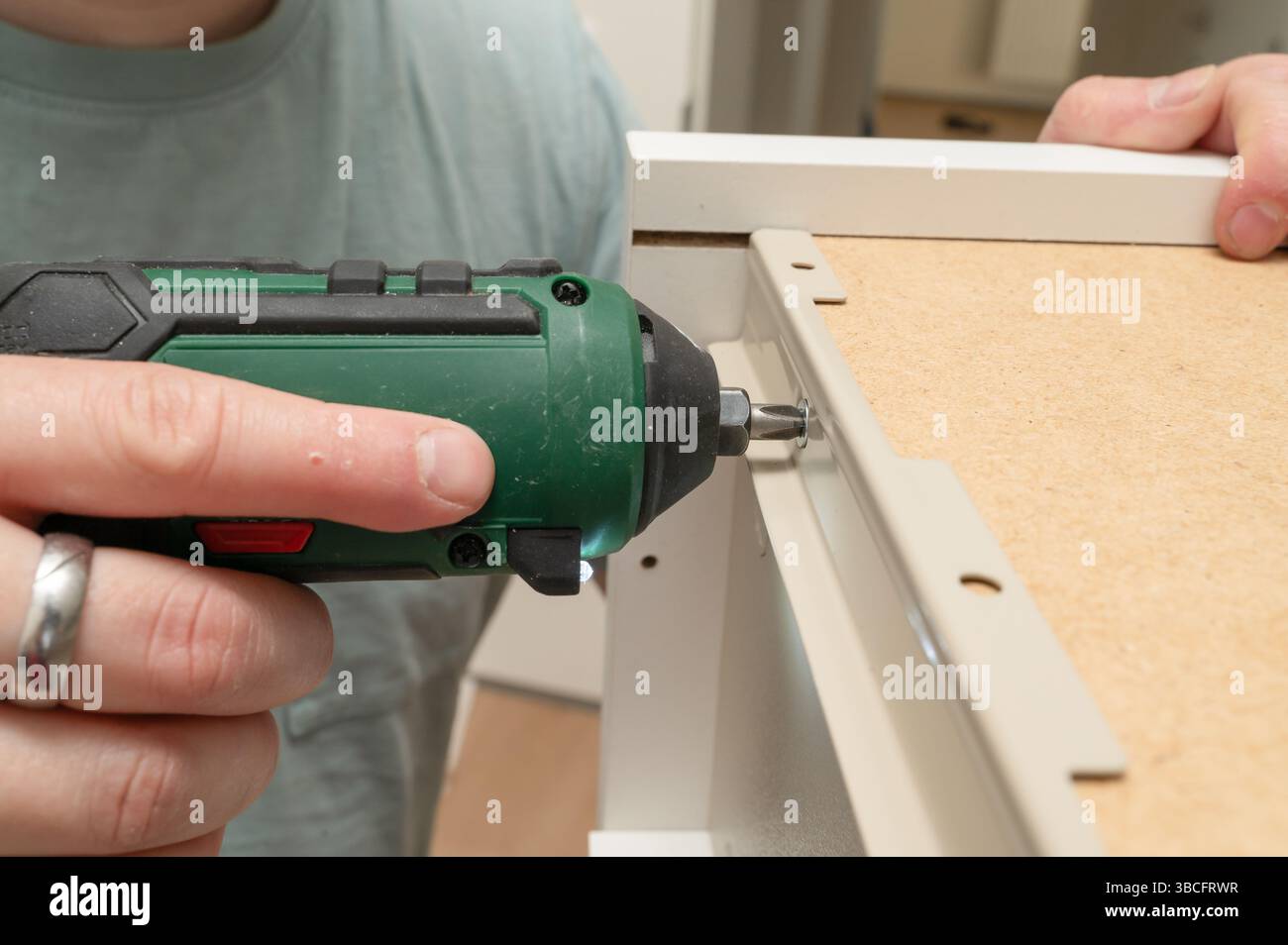 Assembling Furniture Efficiently and Effectively with the Help of a Power Drill Tool Stock Photo ...