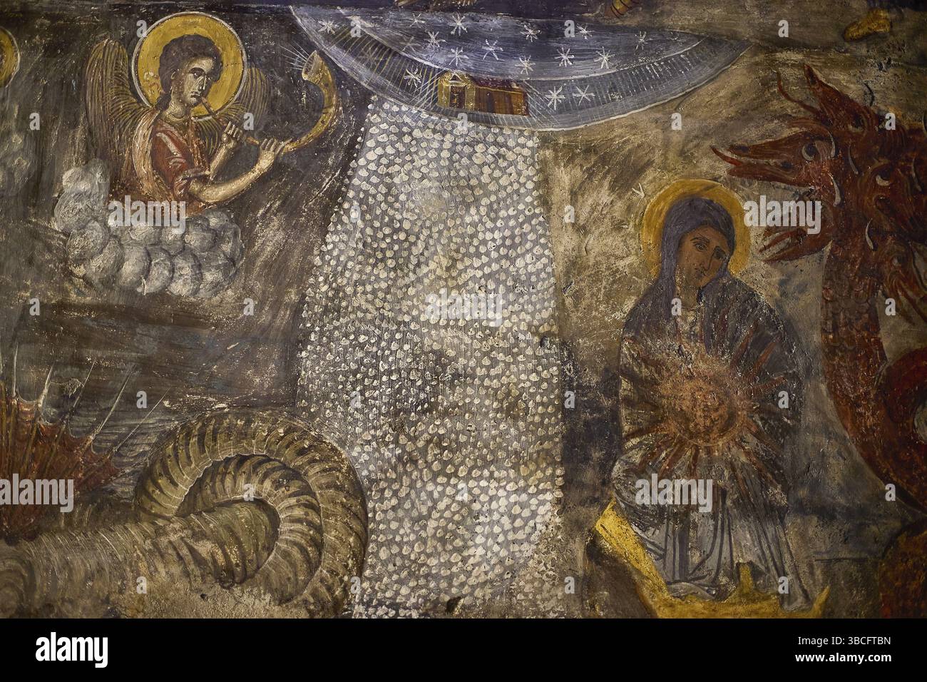 A fresco shows an angel and Mary under a starry sky with a dragon-like ...