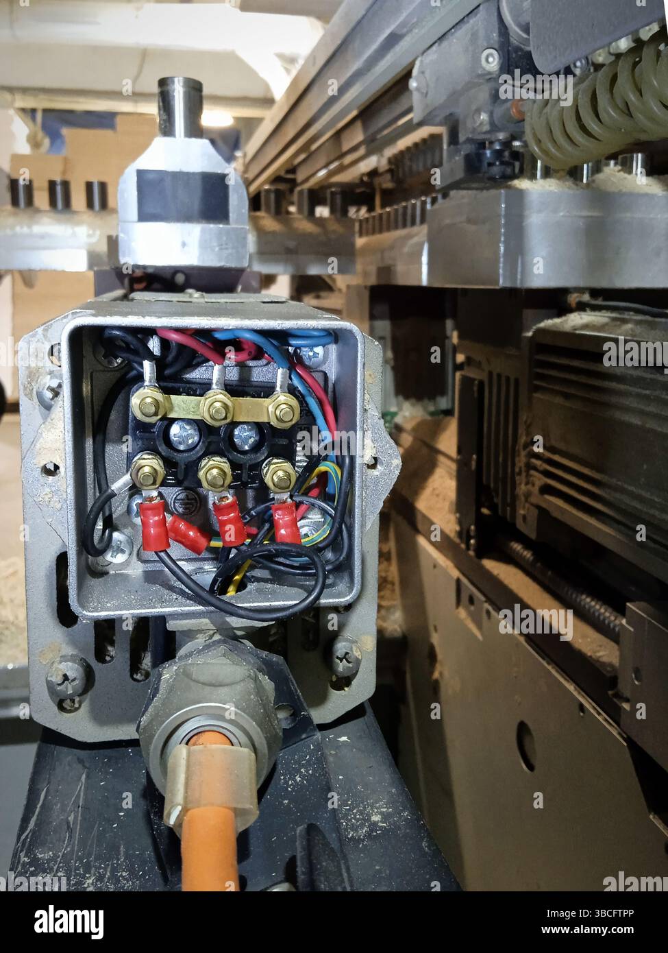 Electric motor distribution box. CNC drilling machine Stock Photo - Alamy