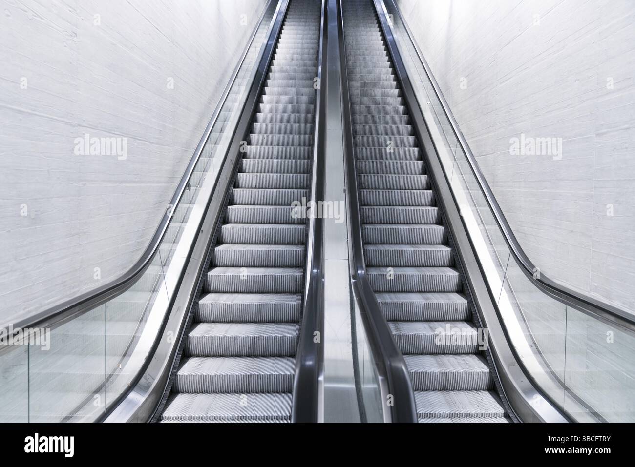 A horizontal view of an empty long escalator in a train station Stock ...
