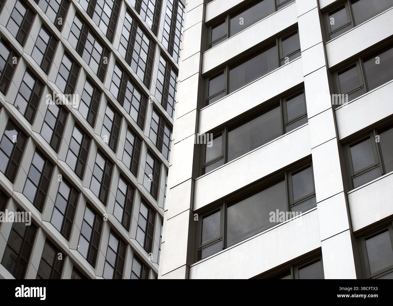 Close up detail of tall high rose modern apartment buildings with white ...