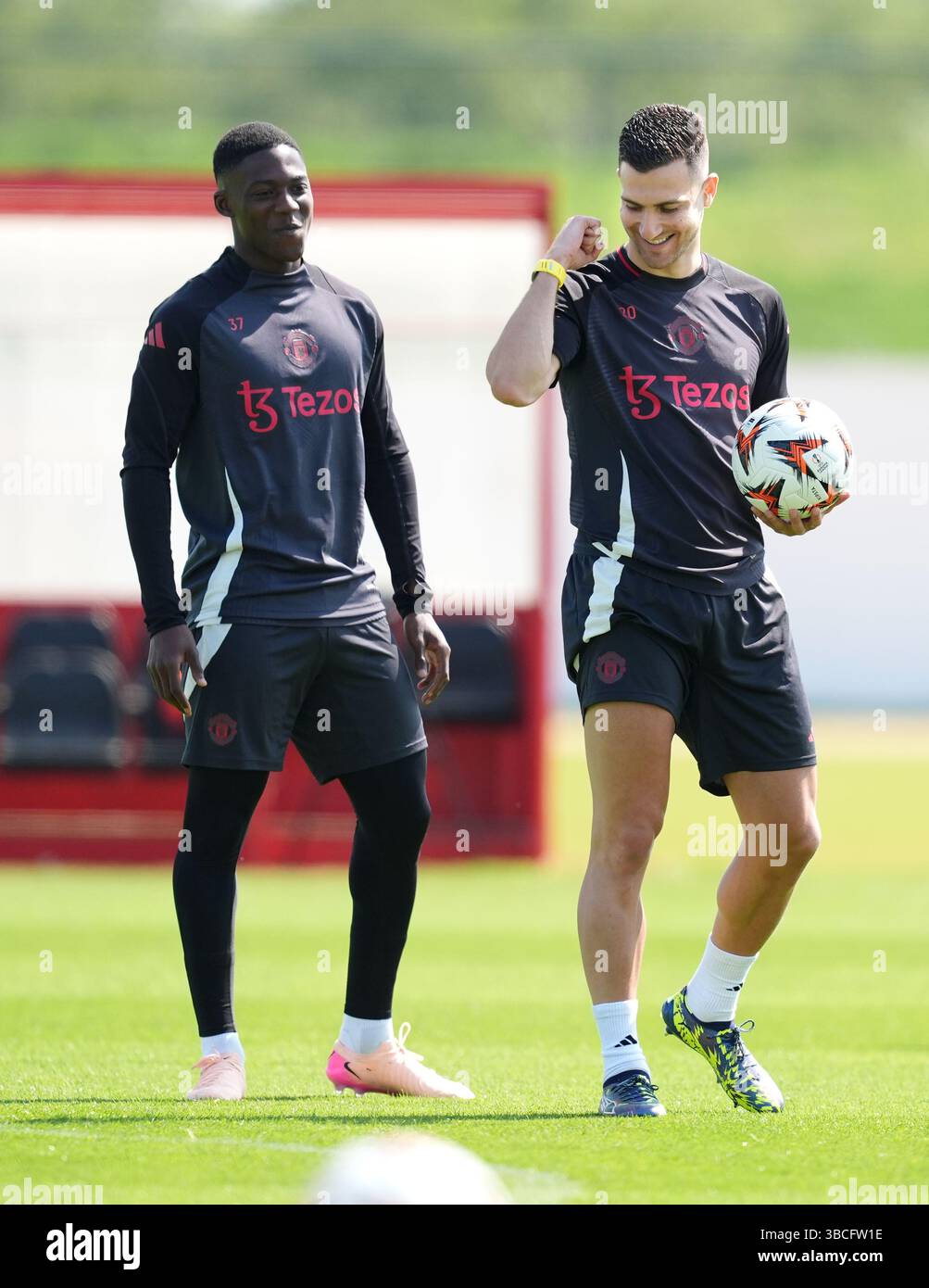 Manchester United's Diogo Dalot (right) and Kobbie Mainoo during a ...