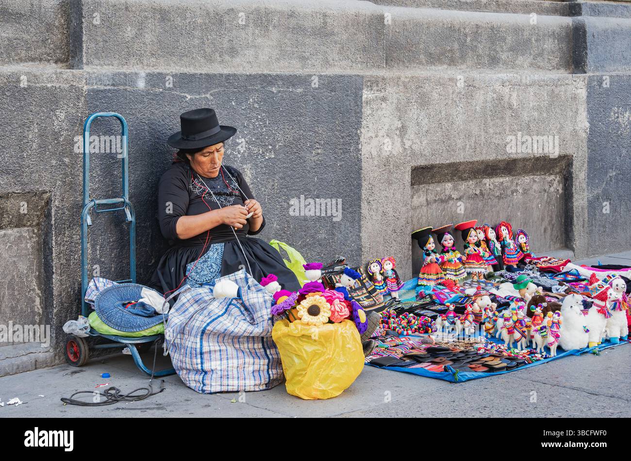 Lima, Peru - March 11, 2025: Peruvian woman selling and crafting ...