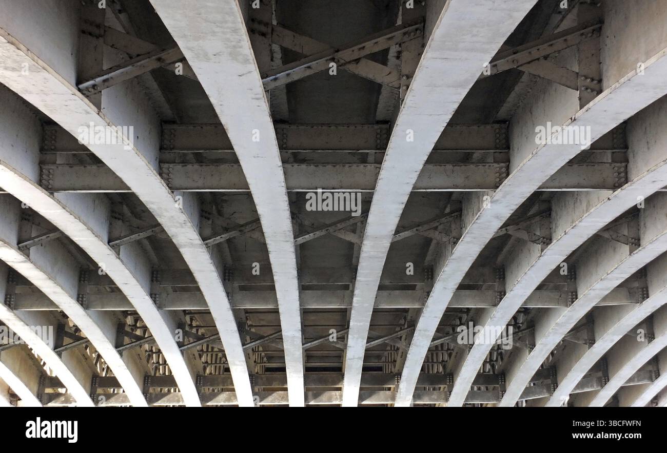 Perspective view of curved arch shaped steel girders under an old road ...