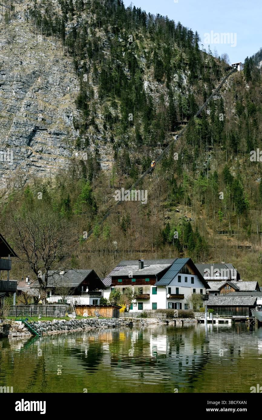 Hallstatt Austria. Traditional houses lake shore mountain backdrop Alps ...