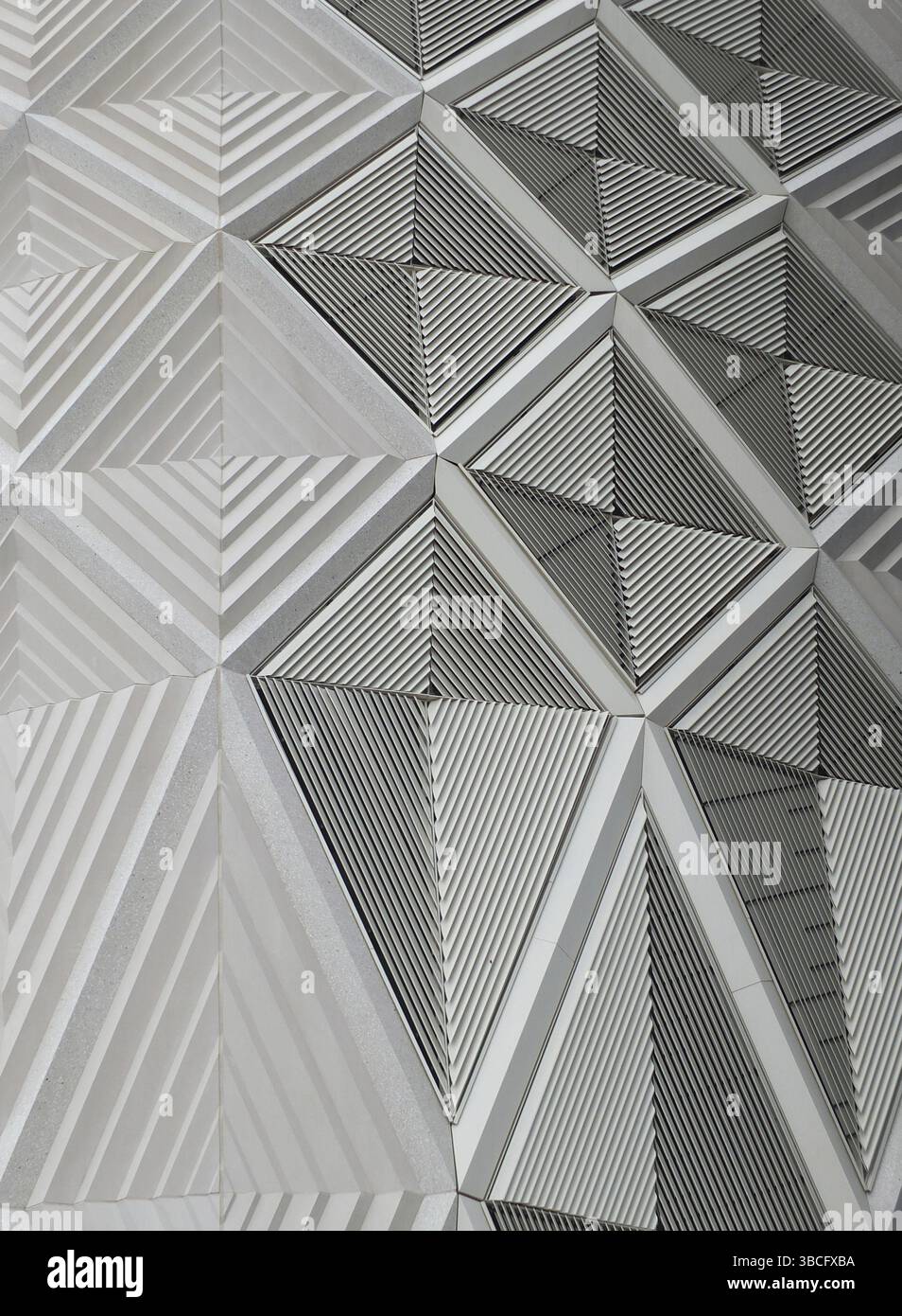 Geometric white patterns and cladding on wall of a modern building ...