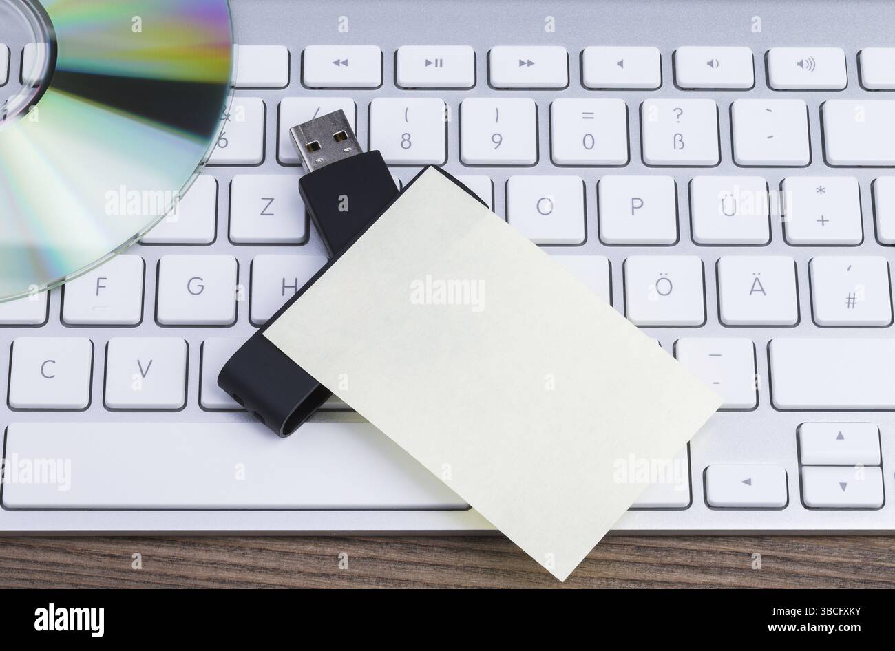 Shows a keyboard, CD and USB memory stick Stock Photo - Alamy