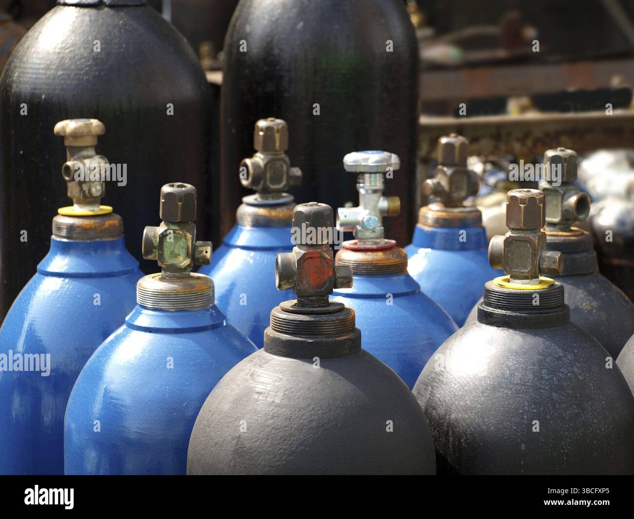 Acetylene and gas steel storage tanks for welding Stock Photo - Alamy