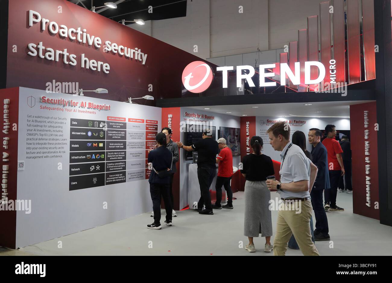 Visitors walk by Trend Micro booth at the Computex Taipei exhibition ...